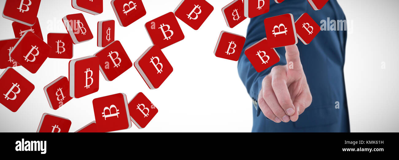 Mid section businessman using invisible imaginary interface against ...