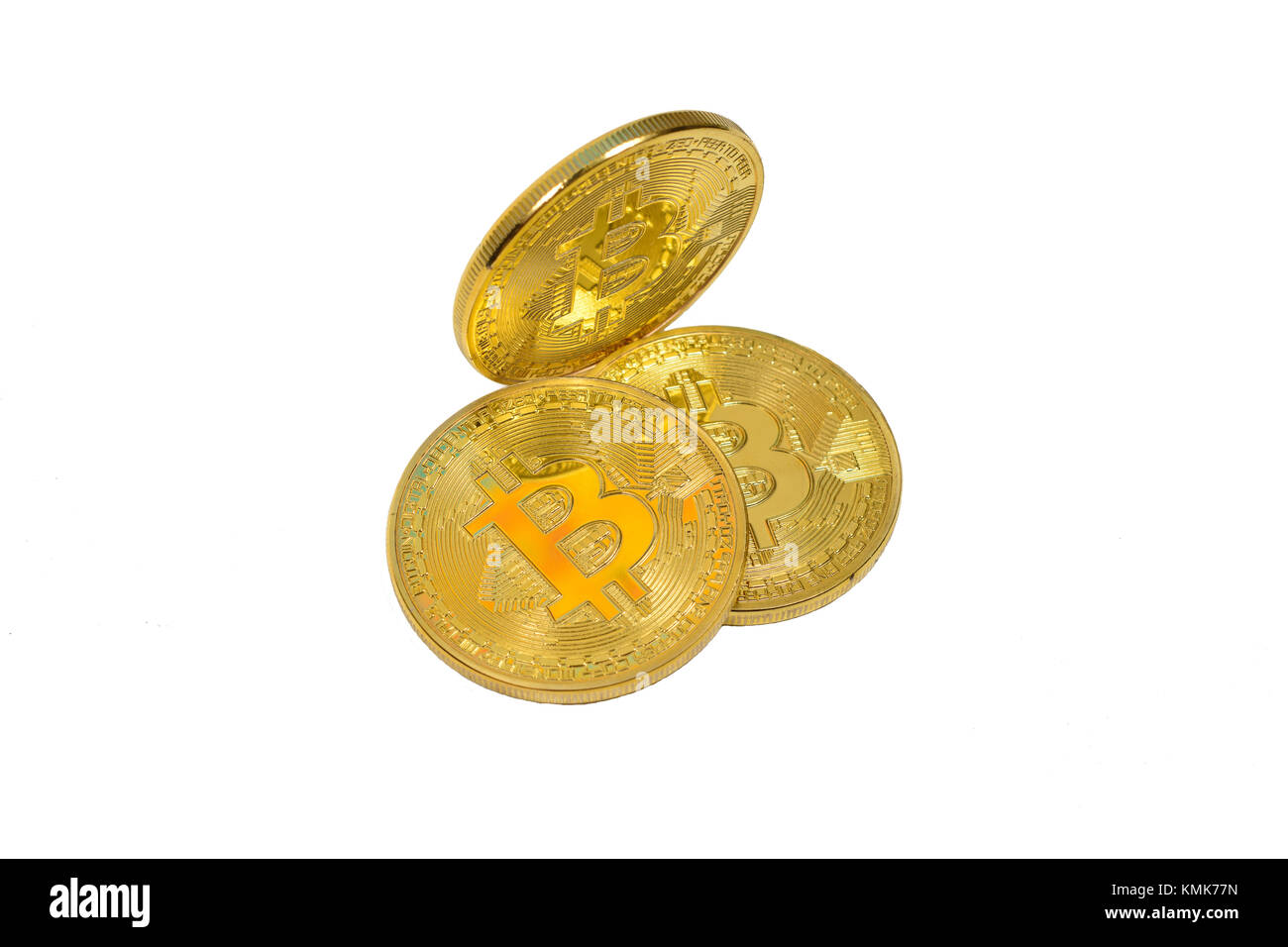 Three yellow metal coins (bitcoin) isolated against white background ...