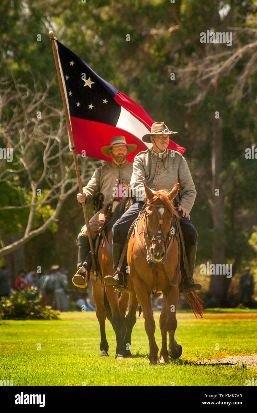Two "Confederate" soldiers on horseback carry the Confederate First ...