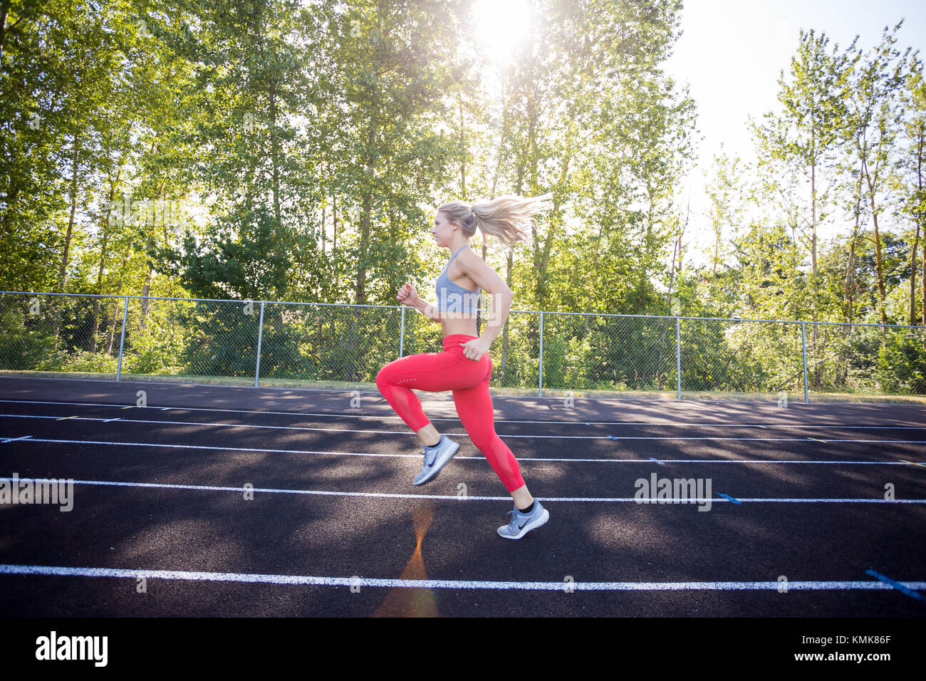 Young Female Athlete Working Out on Track Stock Photo - Alamy