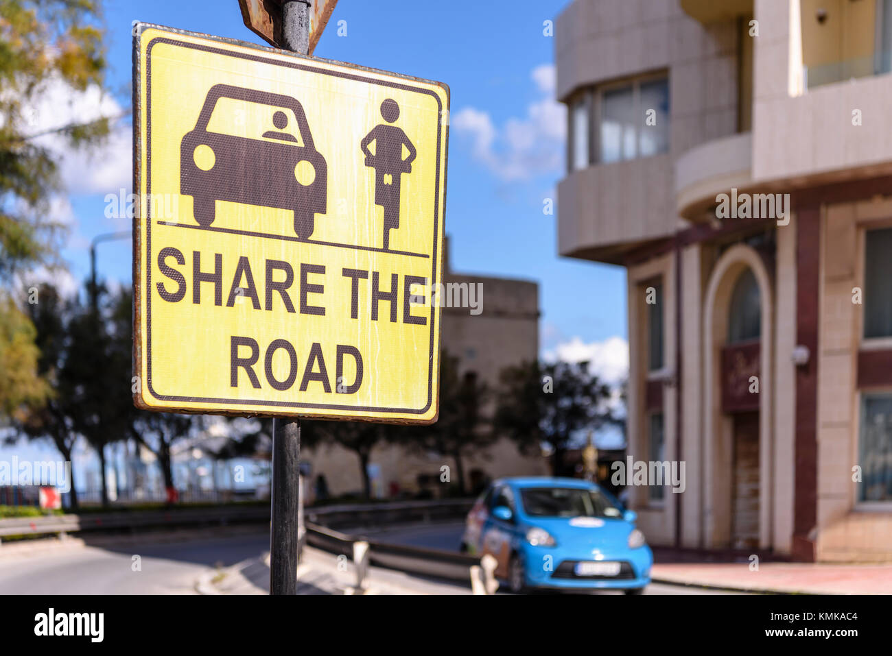 Sign advising road-users to share the road between cars and ...