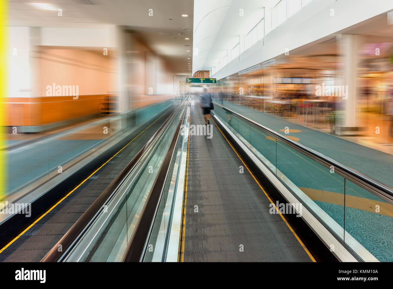 Modern moving walkway speed-walk for the passengers at the airport with ...
