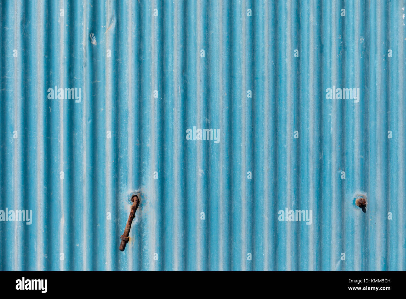 Light blue corrugated metal wall with rusty bolts Stock Photo - Alamy