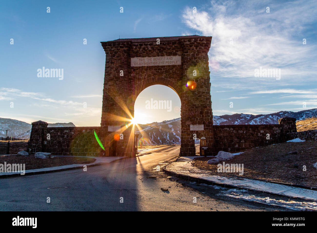 The sun rises over the Roosevelt Arch during the winter at the ...