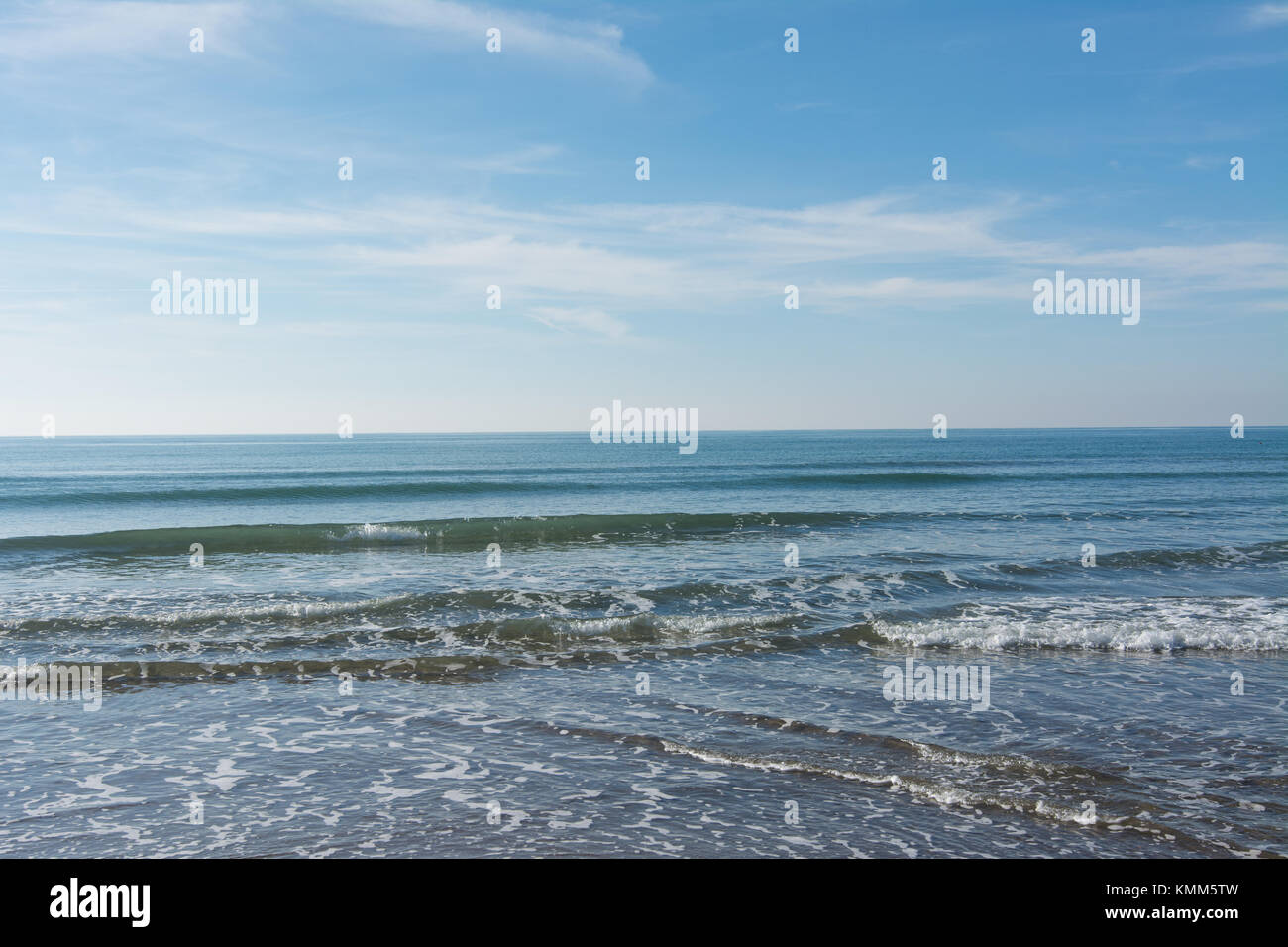 waves, sea and sun reflecting from the beach - background Stock Photo ...