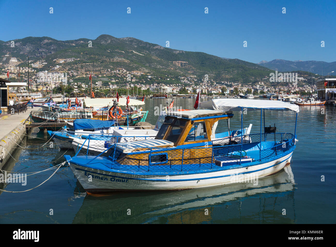 Fishing boats and excursion boats at the harbour of Alanya, turkish ...