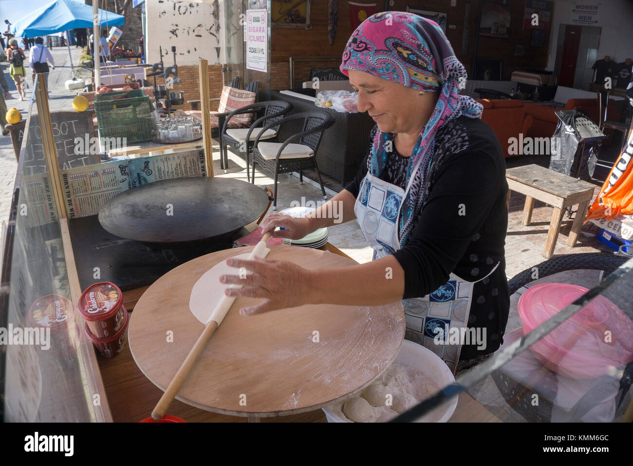 Turkish woman prepares Pide (flat bread) at the old town of Side ...