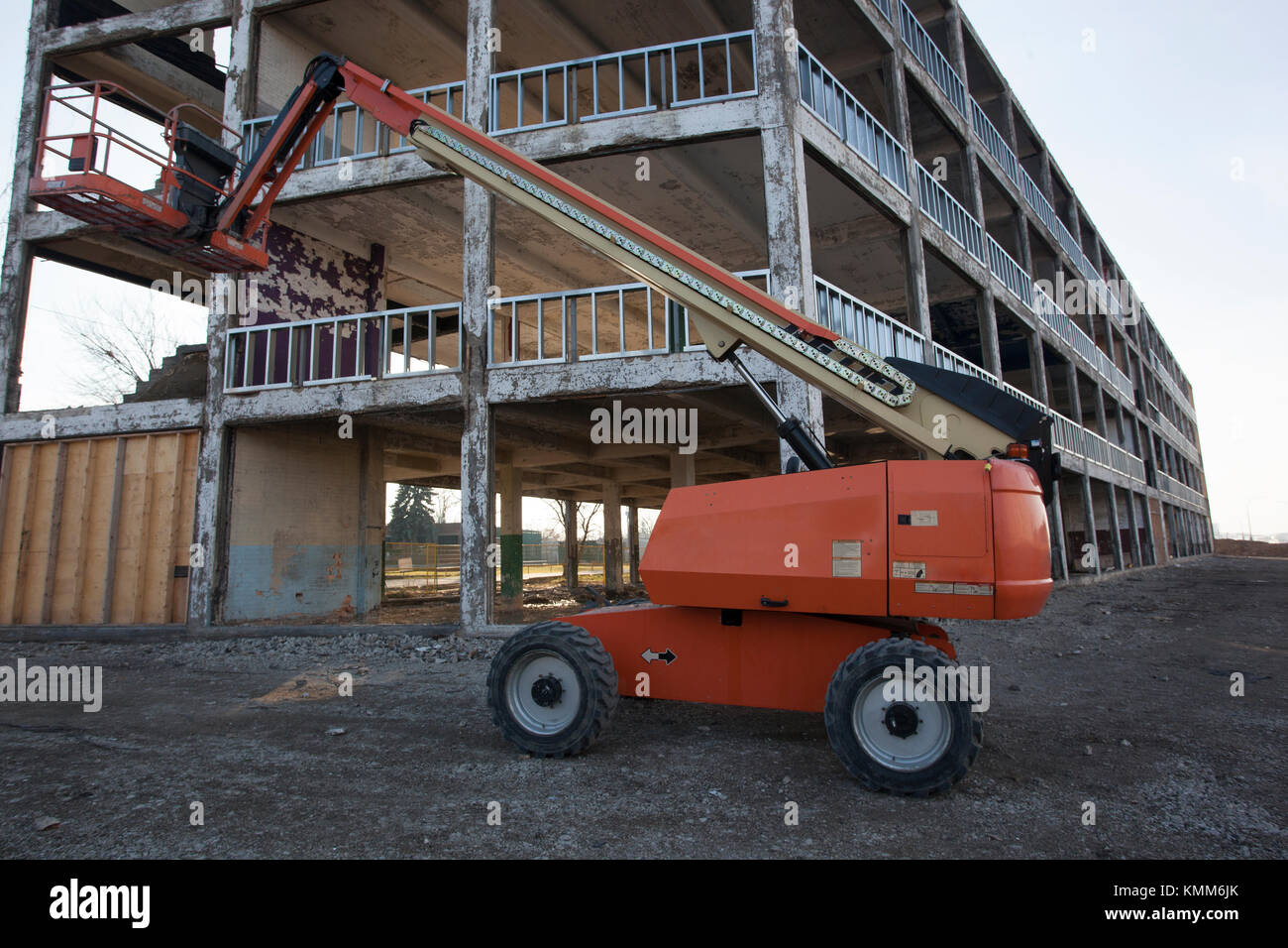 Boom Lift parked on Construction Site with boom raised Stock Photo - Alamy