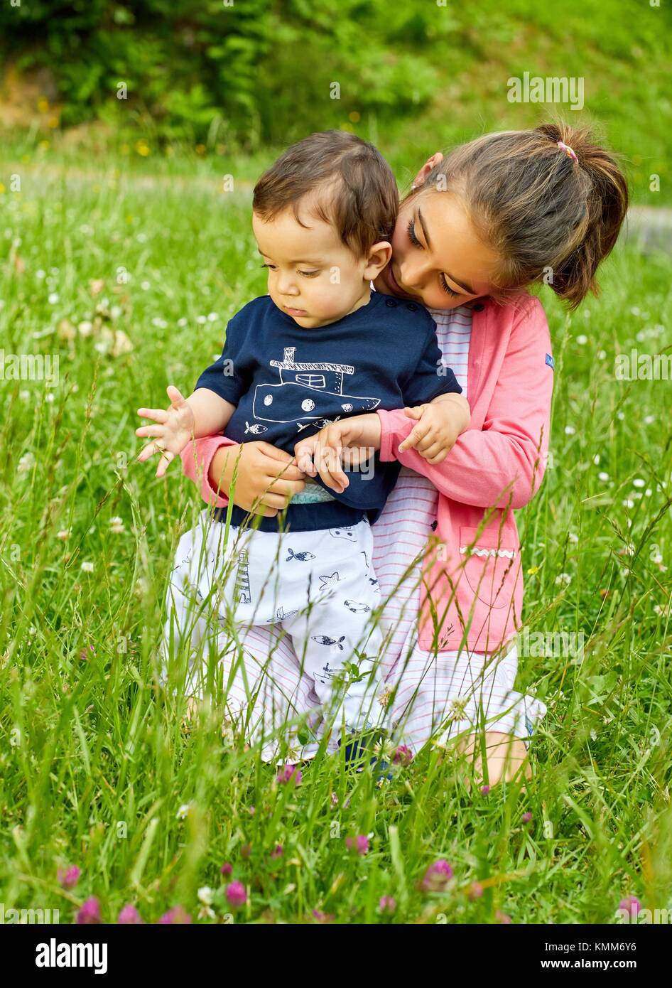 Girl and baby, garden, Gipuzkoa, Basque Country, Spain Stock Photo - Alamy