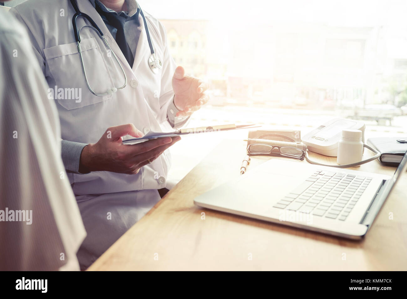 Doctors and patients sit and talk to the patient about medication. At ...