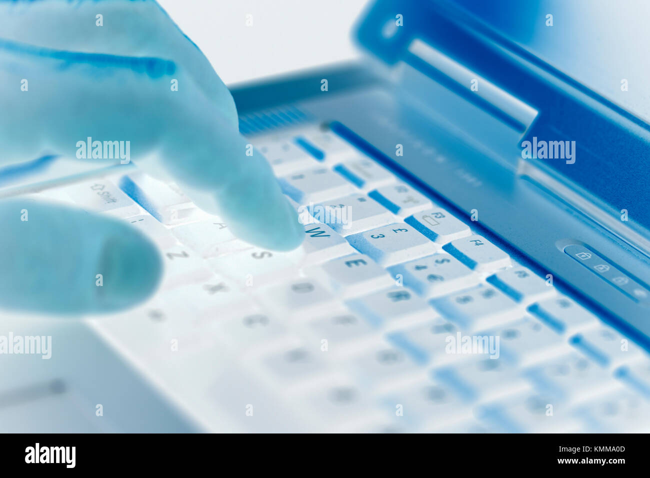 Man pressing a key on a laptop keyboard Stock Photo - Alamy