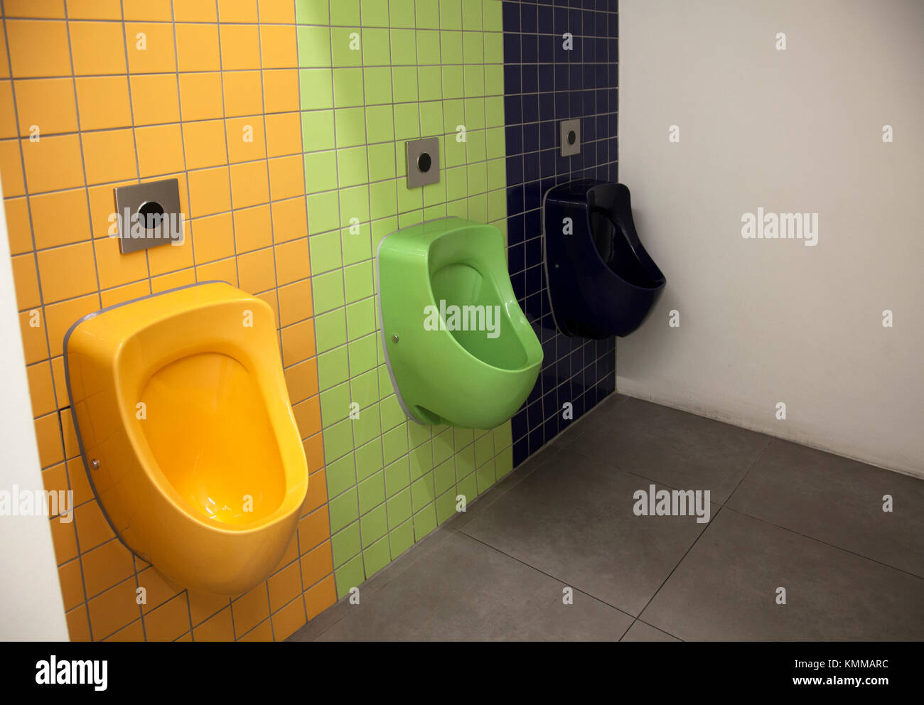 Brightly Tiled Restroom Urinals Stock Photo - Alamy