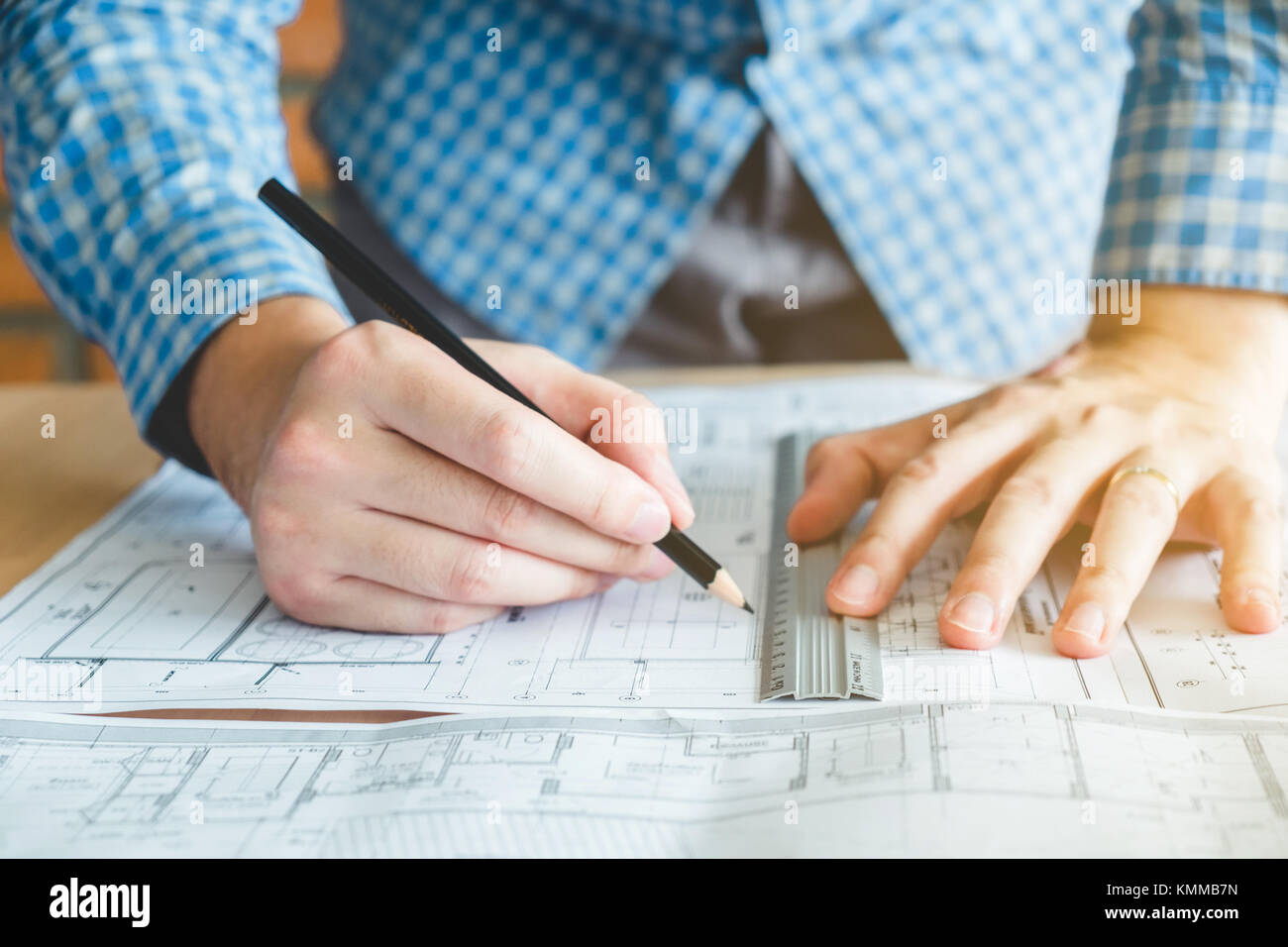 Architect or engineer working in office on blueprint. Architects ...