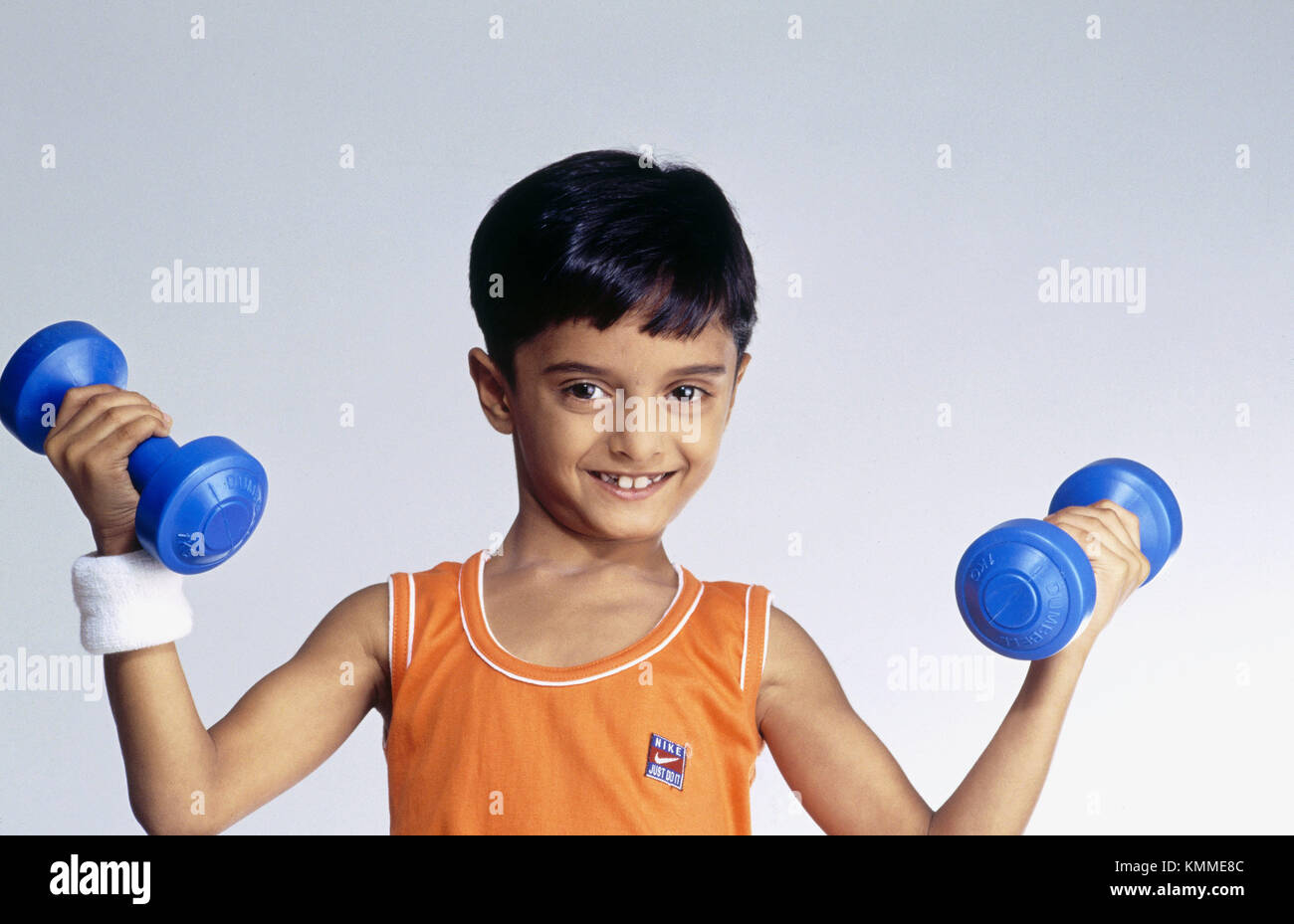 Asian strong boy lifting weights hi-res stock photography and images ...