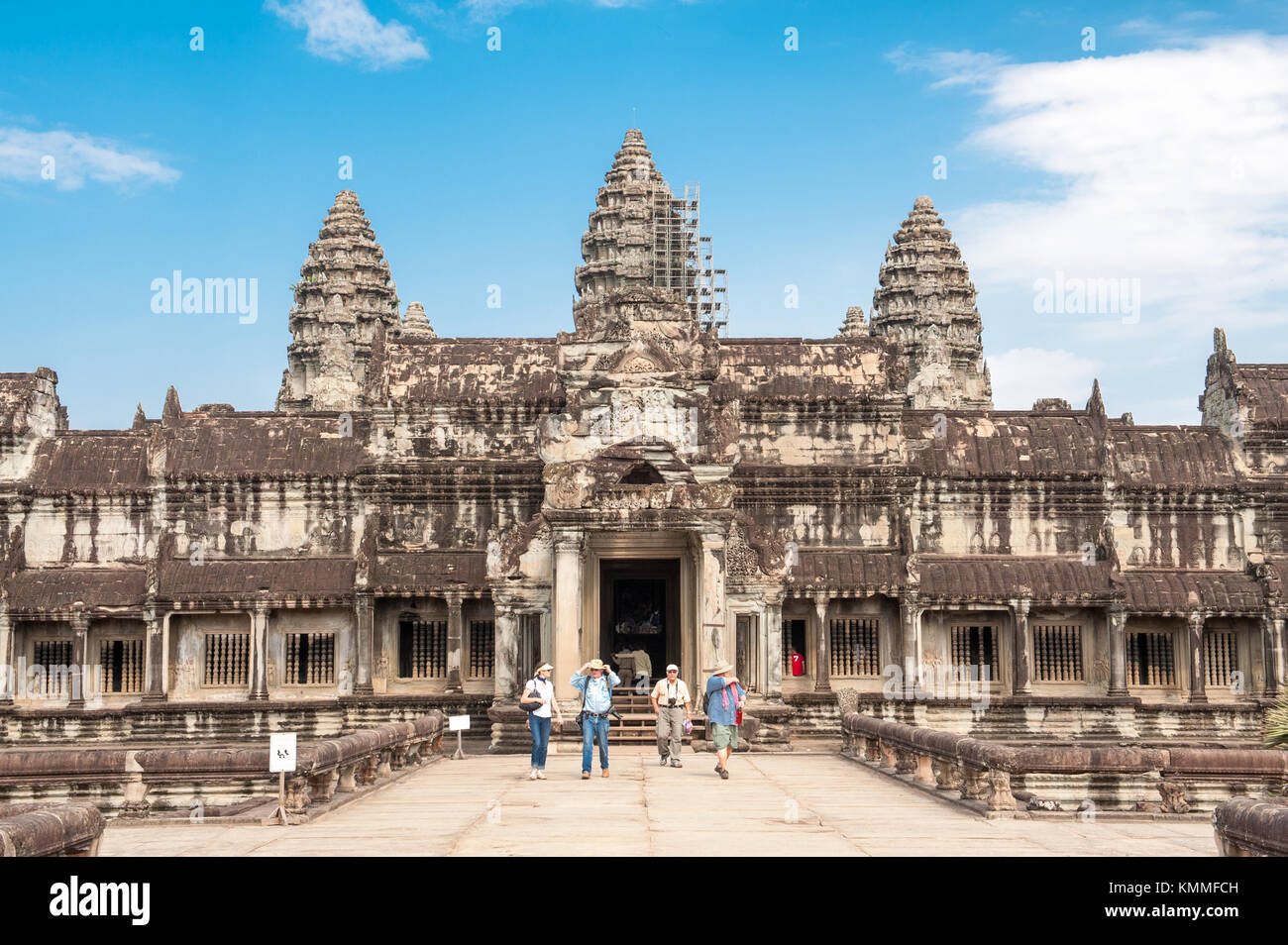 Tourists at Angkor Wat in Siem Reap, Cambodia. Angkor Wat is a 12th ...