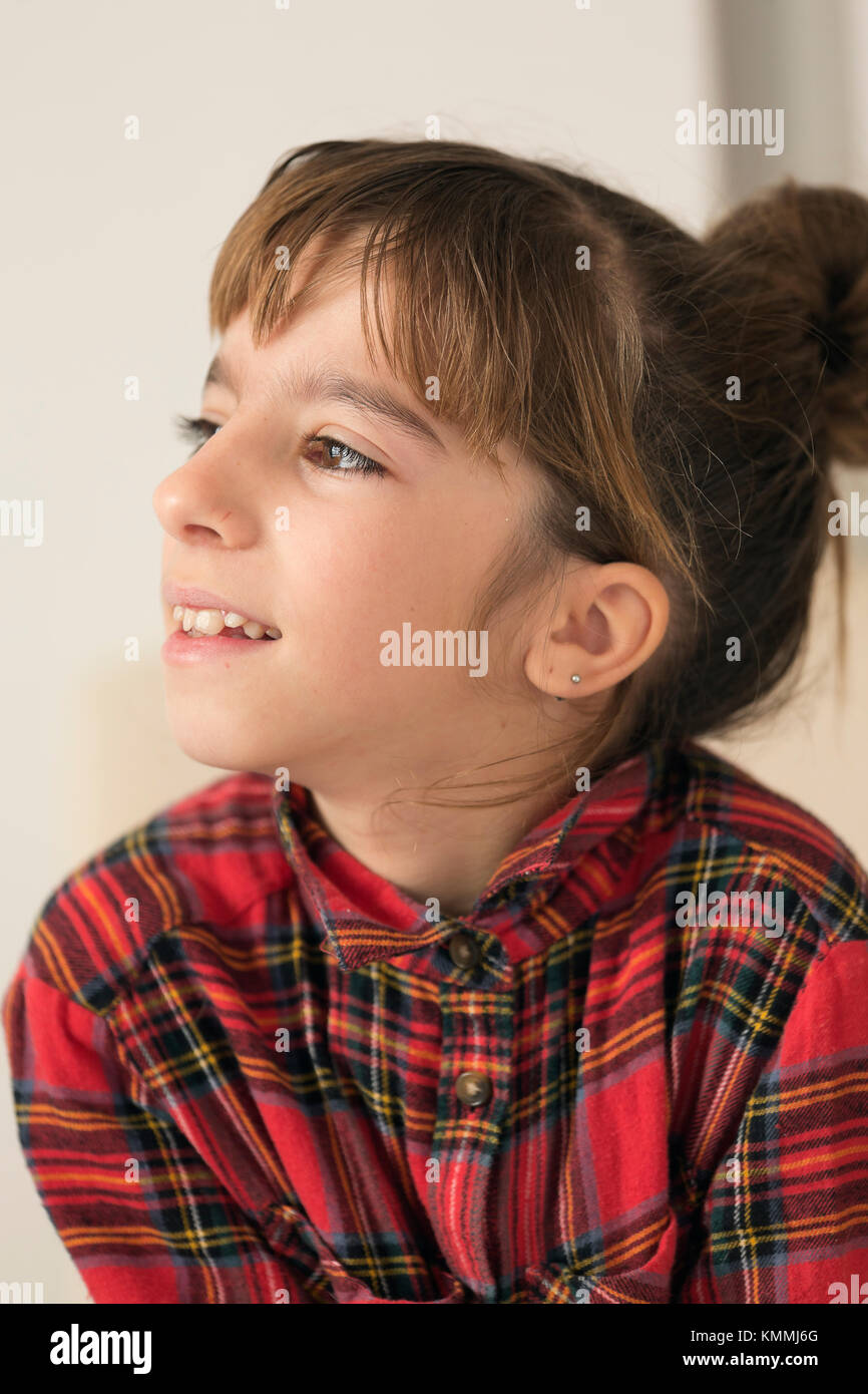 10 year old girl looking to the side with a smile. Vertical shot Stock ...