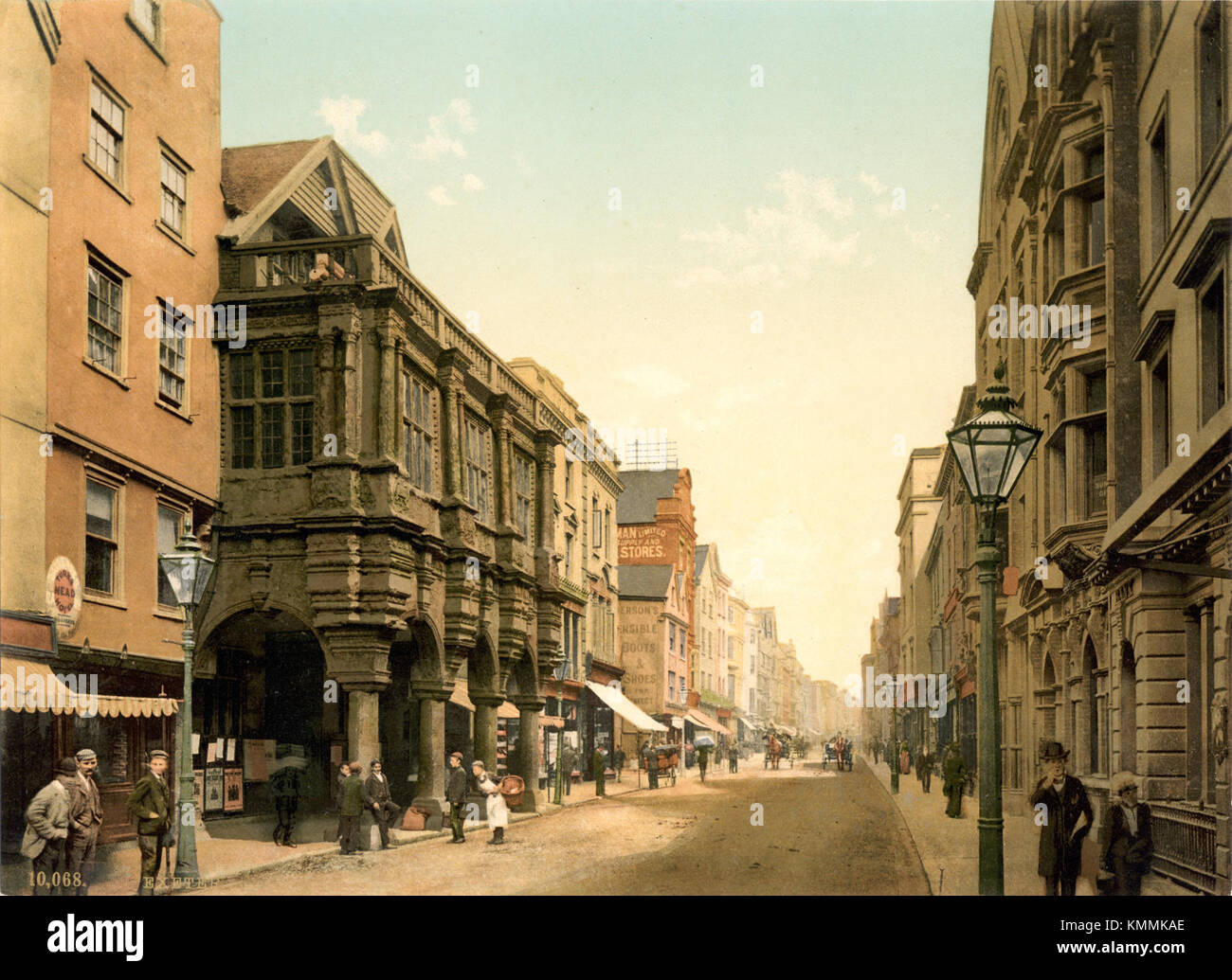 This historical photograph captures High Street in Exeter, England ...