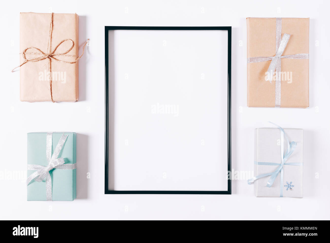 Top view of a box with gifts and blank frame on a white background ...