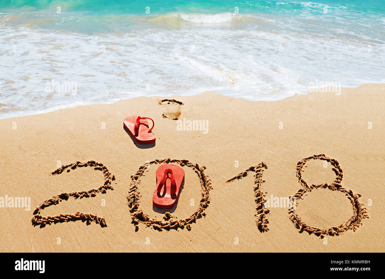 Red flip flops and digits 2018 on the beach sand.Concept of summer ...
