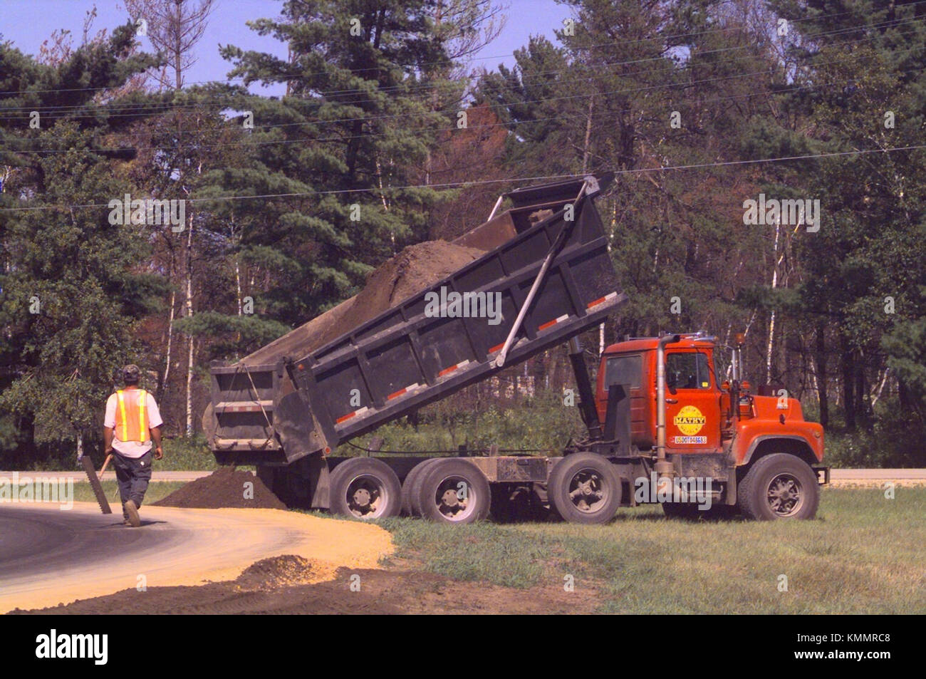 Workers with Mathy Construction of Onalaska work on the running track ...