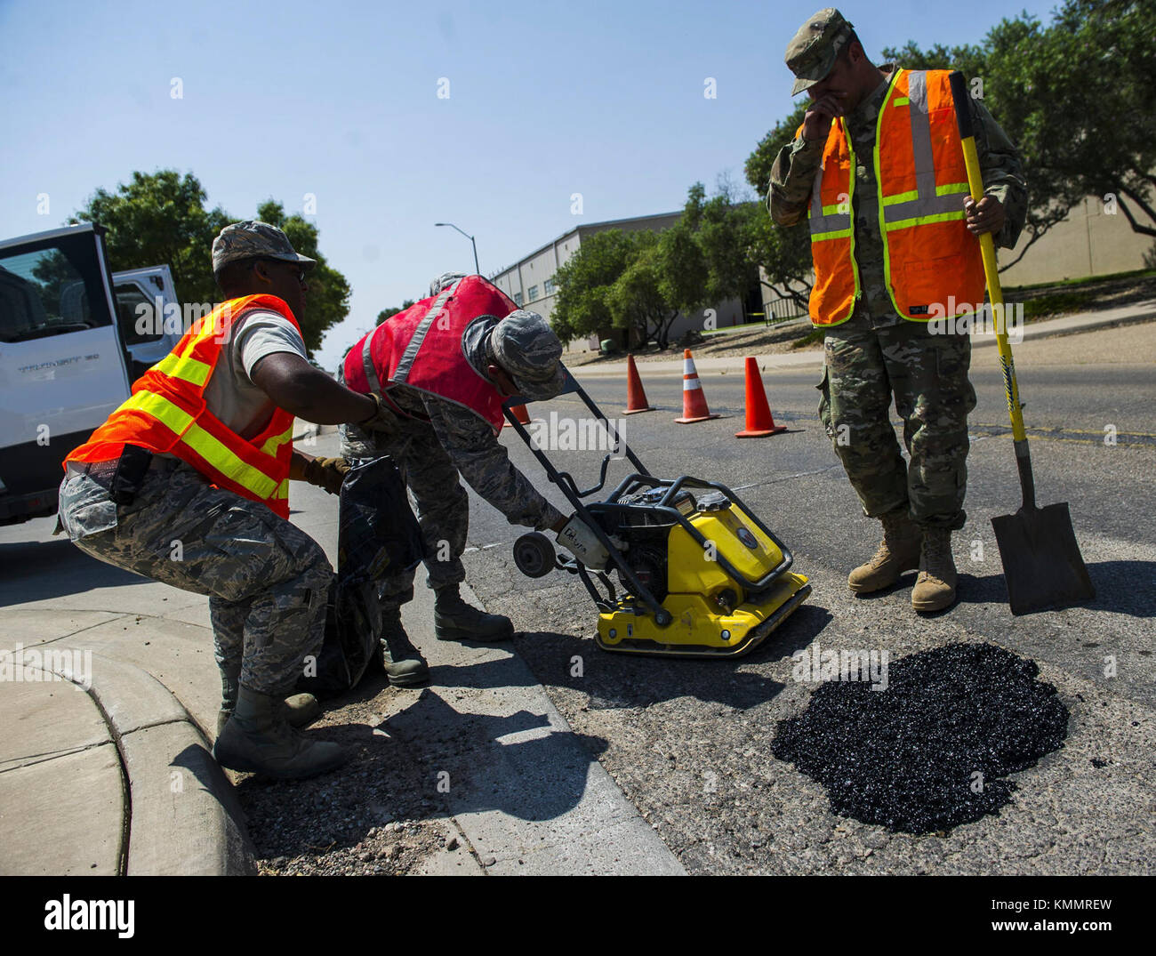 27th Civil Engineer Squadron Airmen fill in a pothole at Cannon Air ...