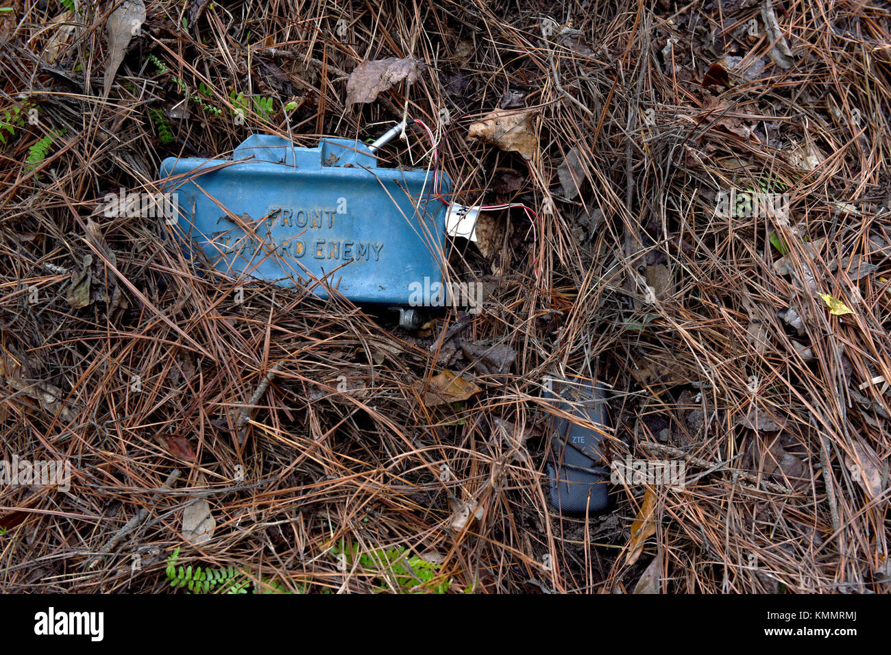 An artificial Improvised Explosive Device lies hidden along a trail at ...