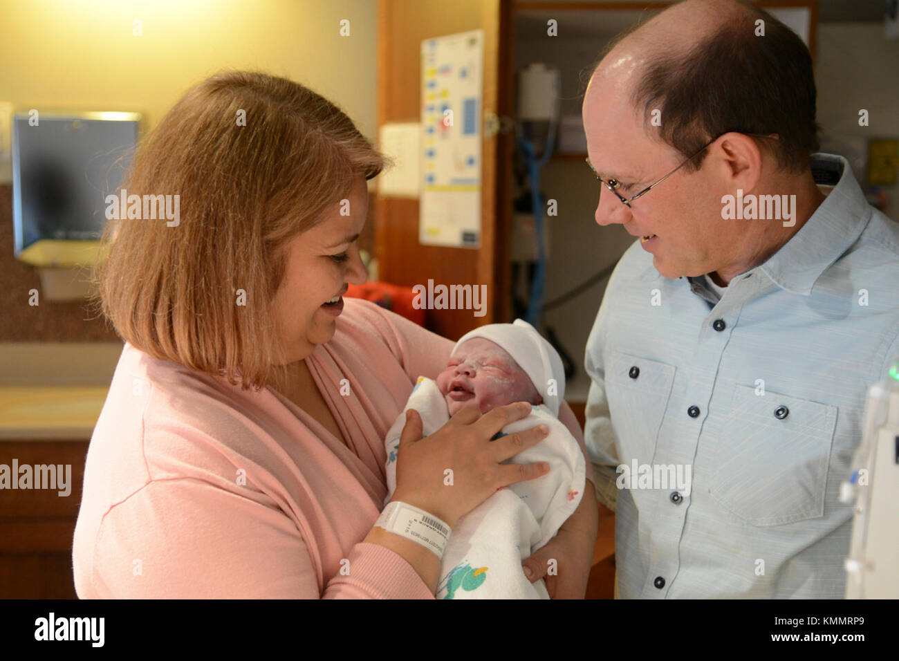 Rex and Gabby Baird hold their newborn baby, Carolena, Nov. 9, 2017, at ...