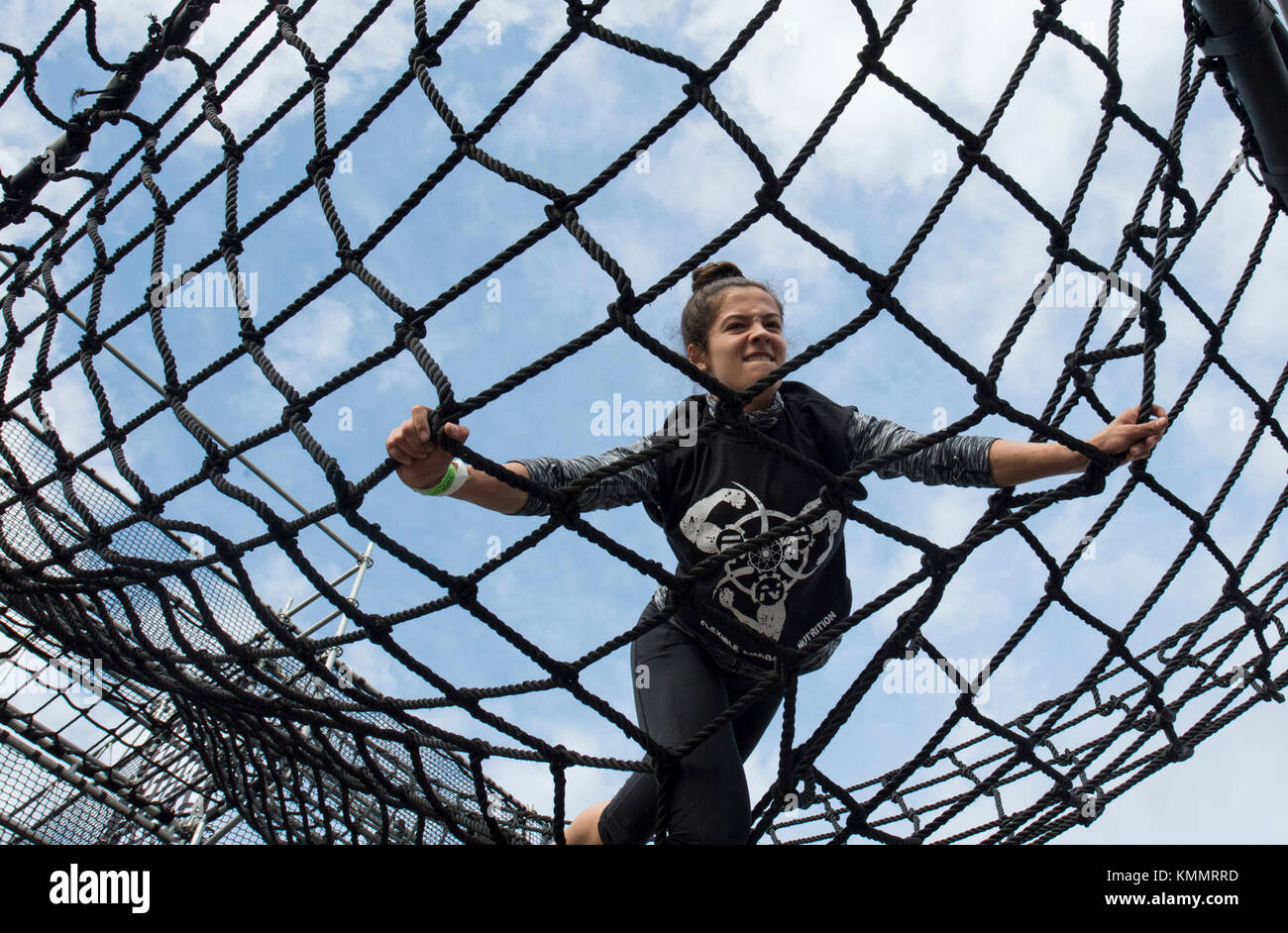 A top female Air Force Alpha Warrior athlete competes on a 32-obstacle ...