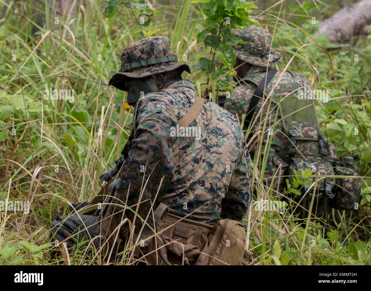 U.S. Marine Cpl. Irving Pino and a soldier in the Malaysian Armed ...