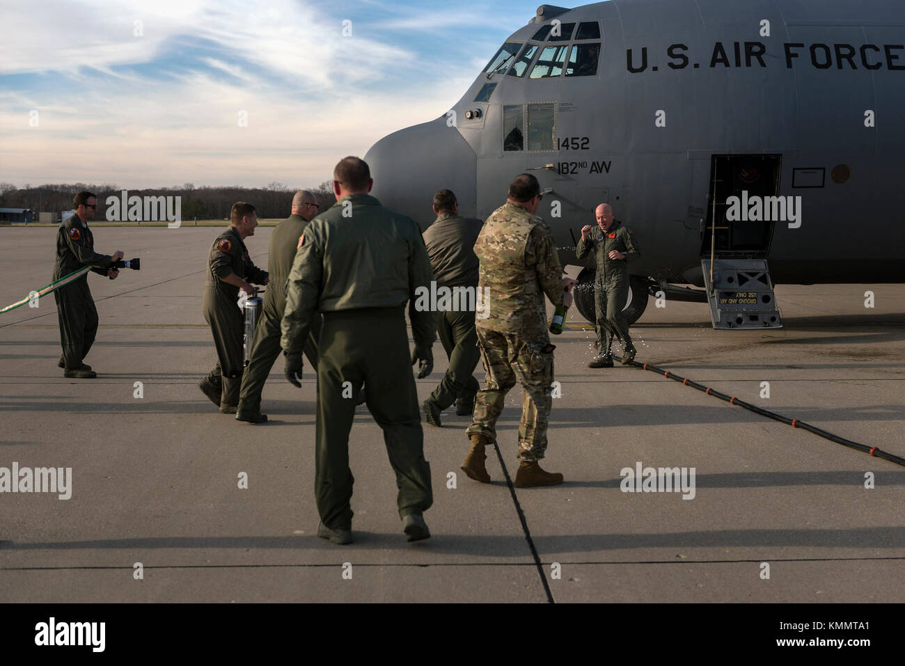 Colleagues hose down U.S. Air Force Lt. Col. Scot Decker, a C-130 H ...