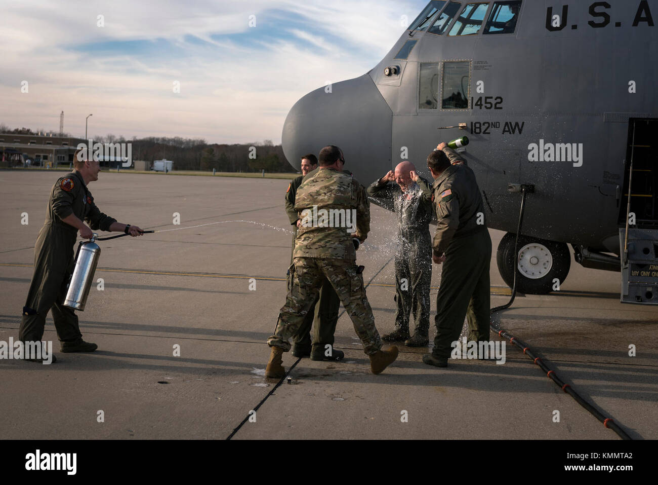 Colleagues hose down U.S. Air Force Lt. Col. Scot Decker, a C-130 H ...
