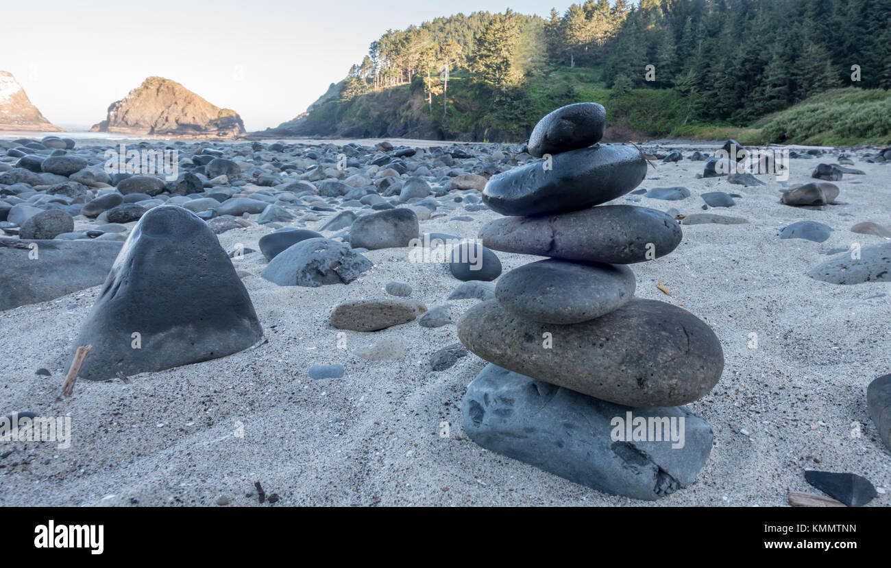Cairn of Smooth Beach Rocks stacked Stock Photo - Alamy