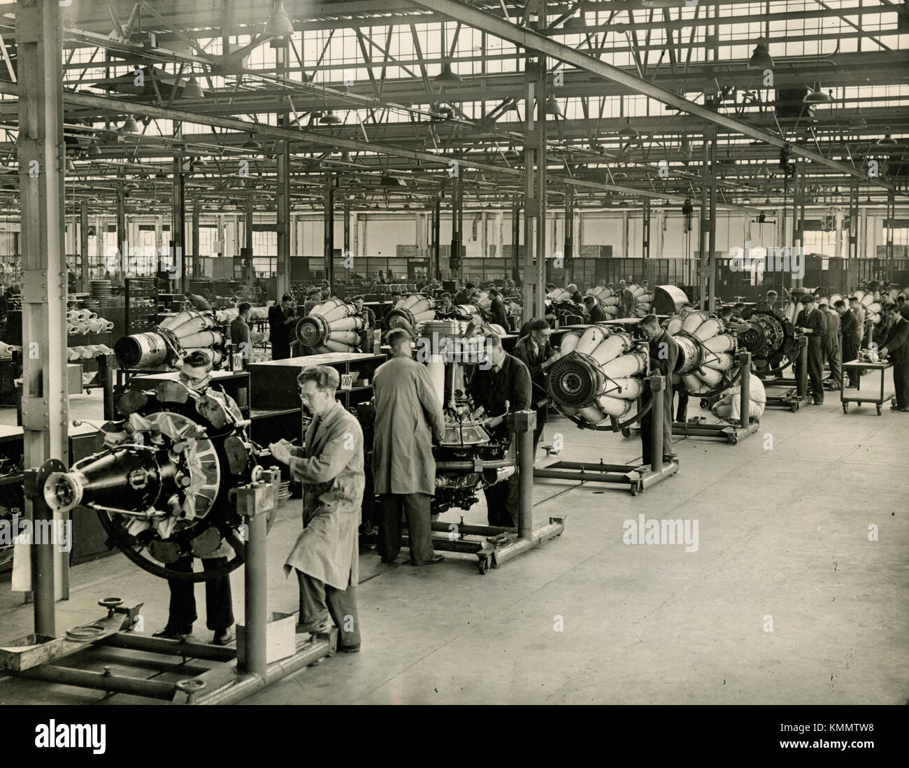 Men working at the assembly line of aviation engines at Rolls-Royce, UK ...