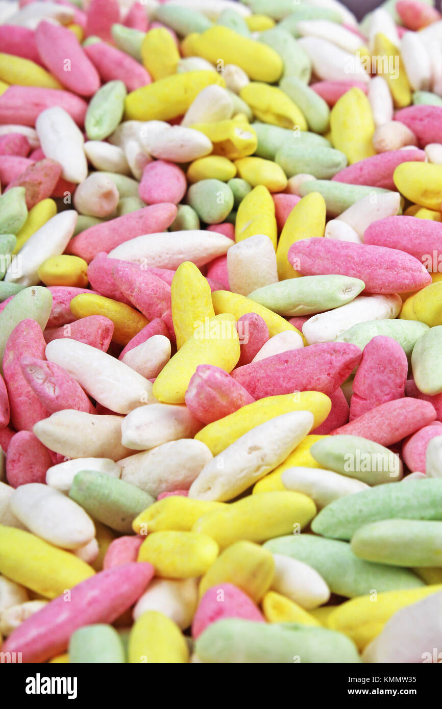 Candy from puffed rice grains. Sweet flavored puffed rice grains ...