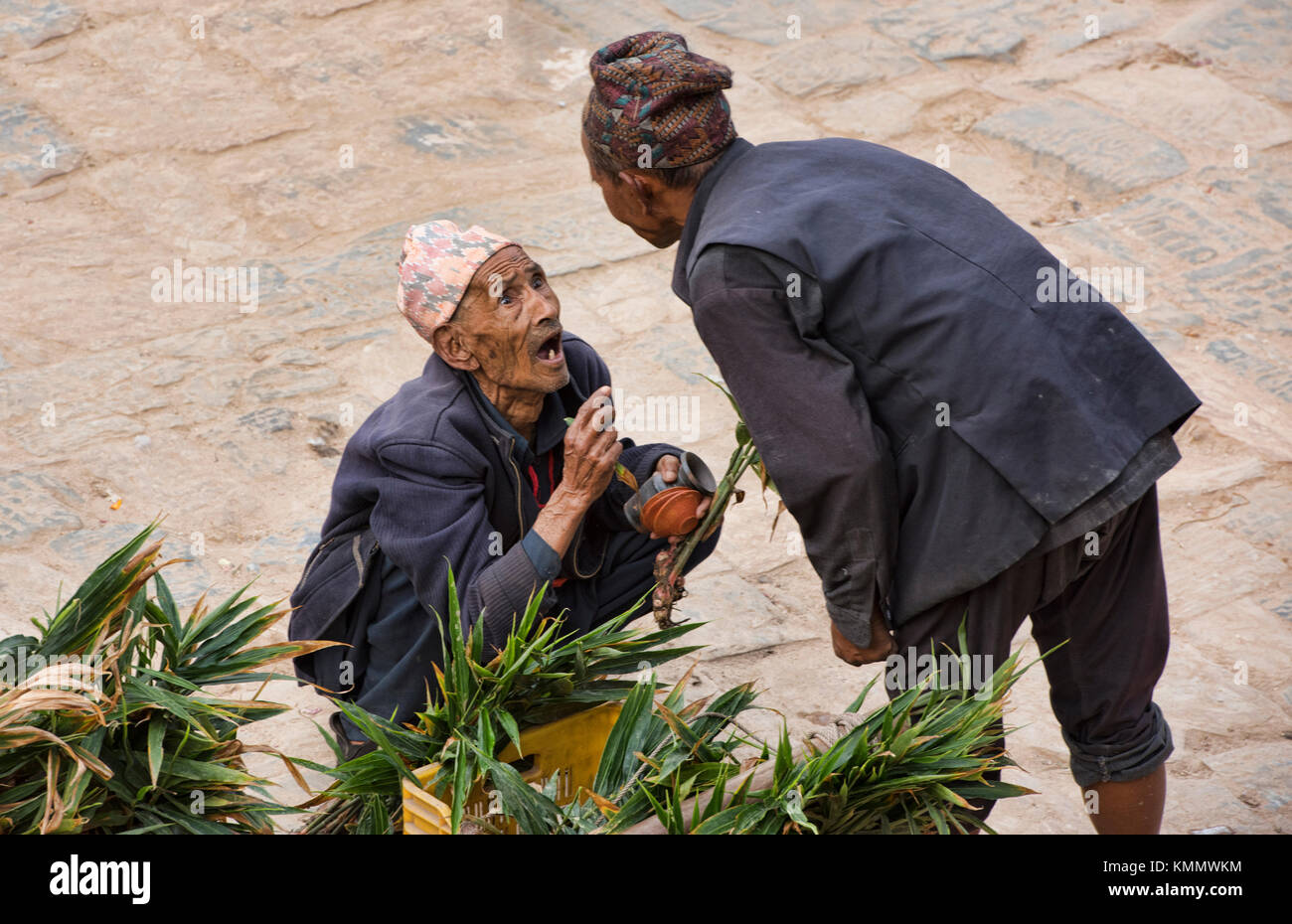 Old men haggling in Taumadhi Square, Bhaktapur, Nepal Stock Photo - Alamy