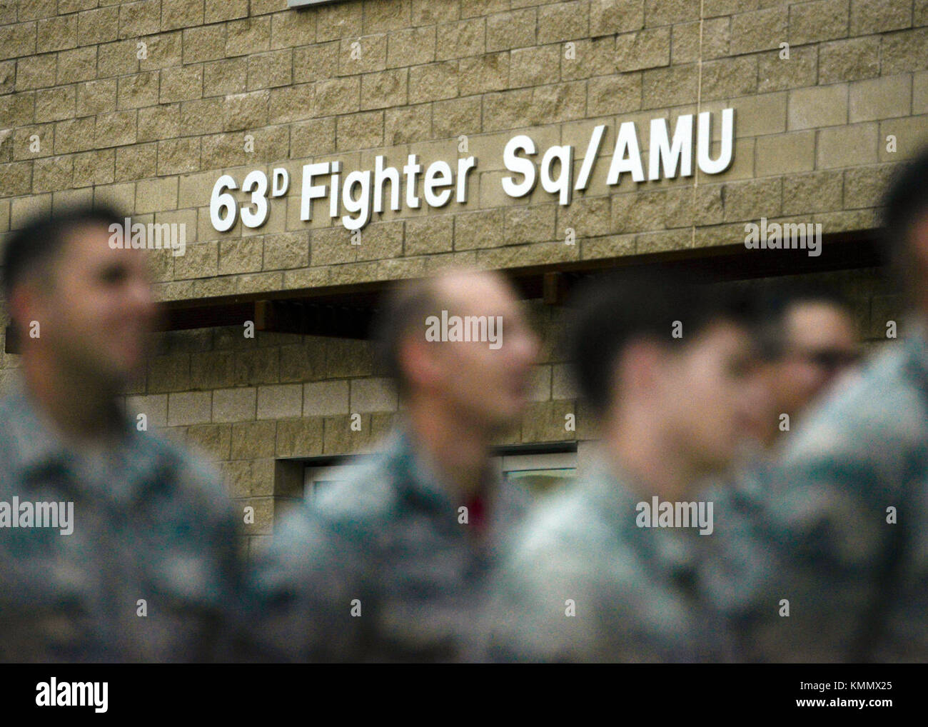 Airmen assigned the 63rd Aircraft Maintenance Unit stand in formation ...