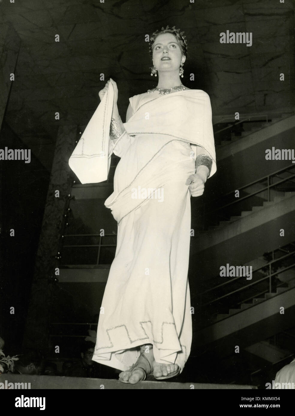 Model in toga at the hairdressing show, Italy 1960s Stock Photo - Alamy