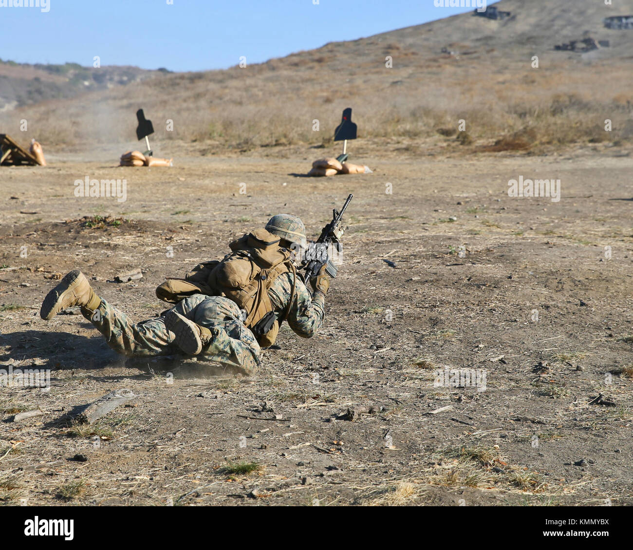 A U.S. Marine with the Infantry Unit Leaders Course drops into the ...