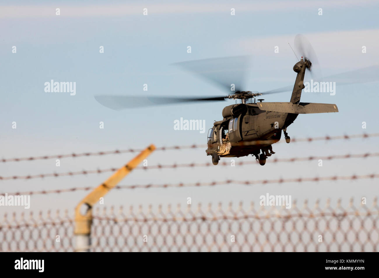 A UH-60 Blackhawk helicopter takes off from a runway during the 20th ...