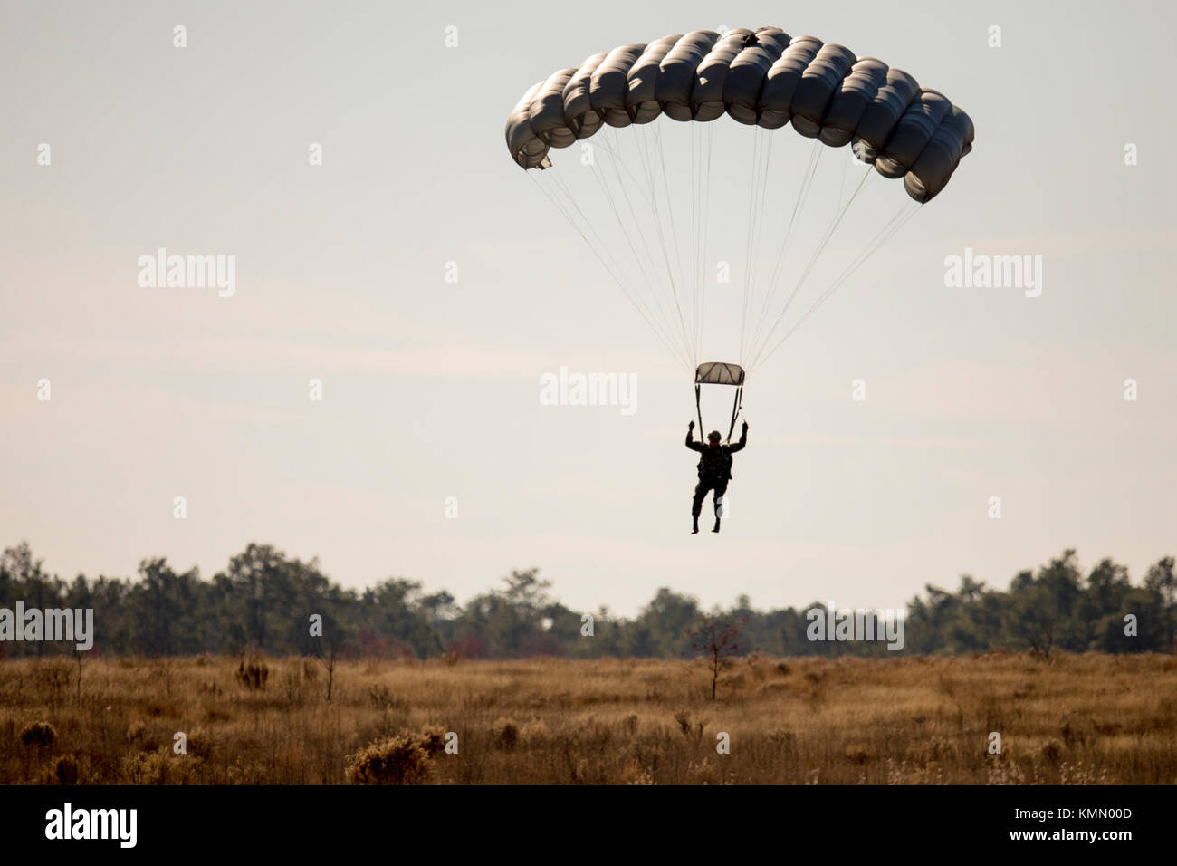 Foreign paratrooper prepares to land at Luzon Drop Zone during the 20th ...