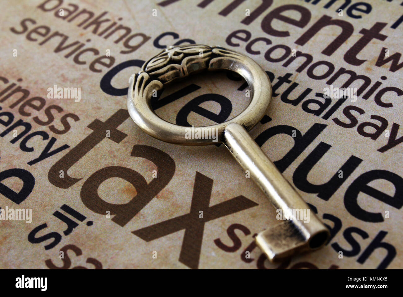 Golden key on tax Stock Photo - Alamy