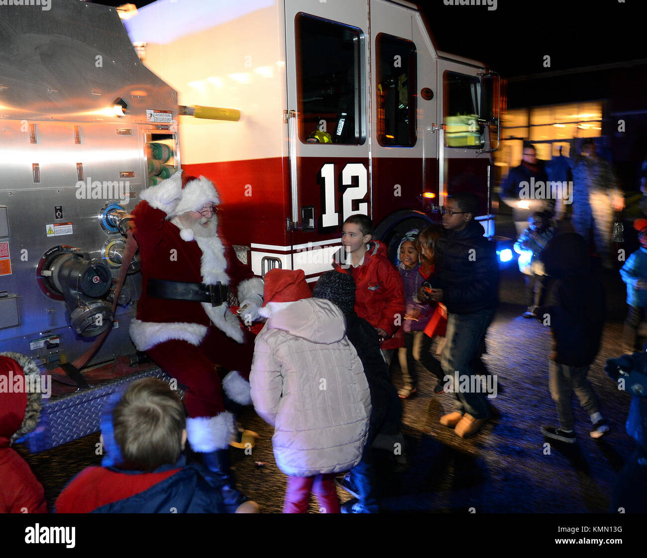 Children gather to get candy and tell Santa what they want for ...