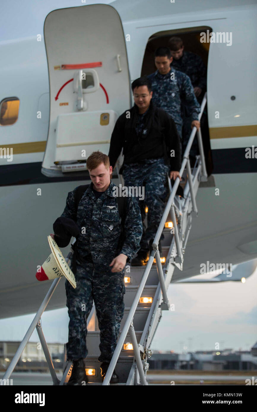 U.S. Navy personnel with Electronic Attack Squadron (VAQ) 141 and ...