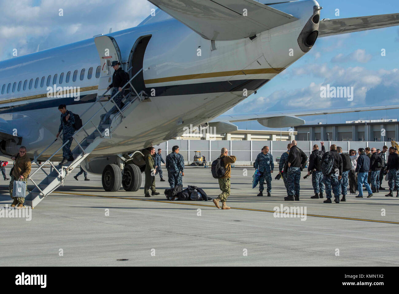 U.S. Navy personnel with Electronic Attack Squadron (VAQ) 141 and ...