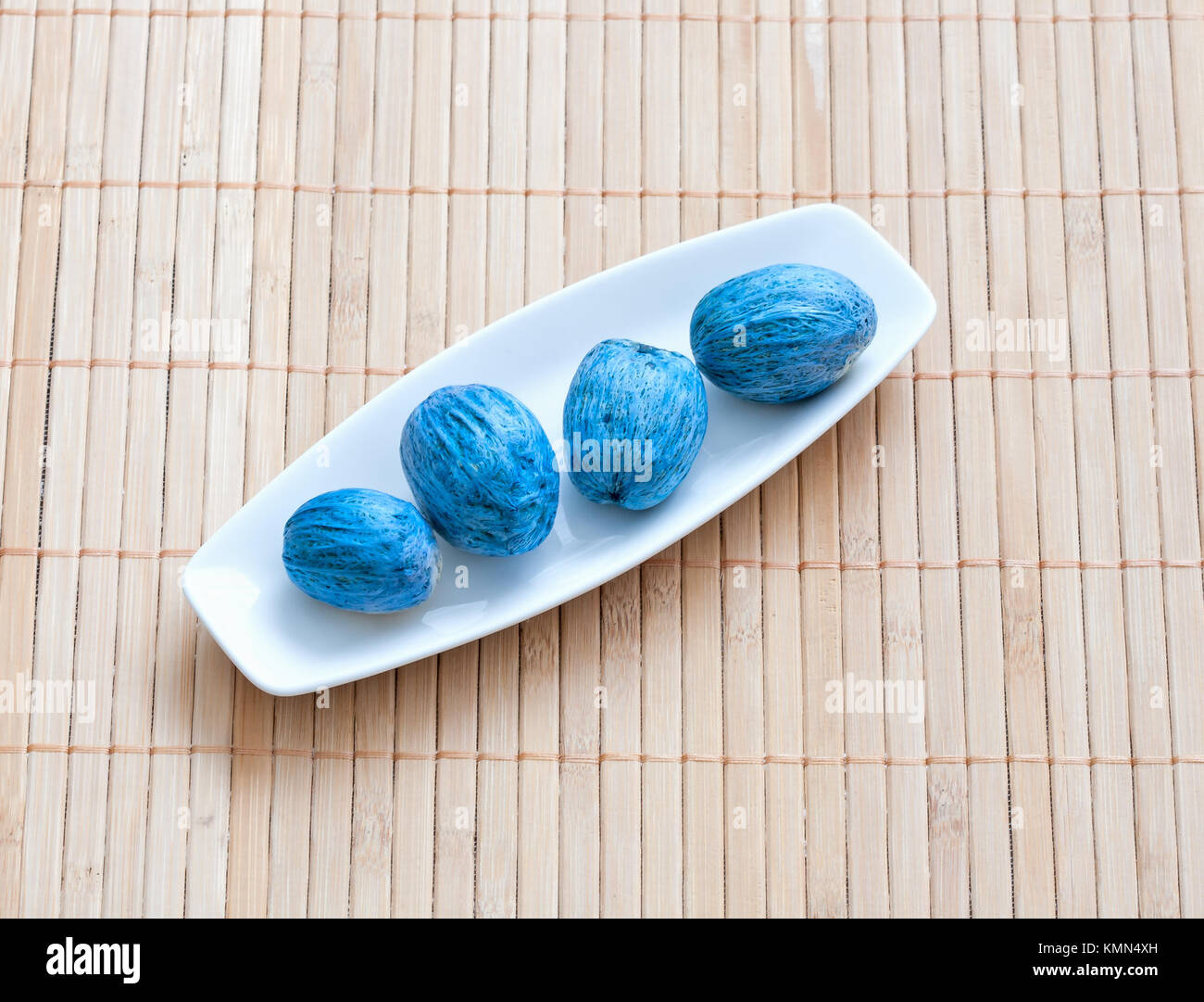 dish of nuts on a bamboo napkin Stock Photo - Alamy