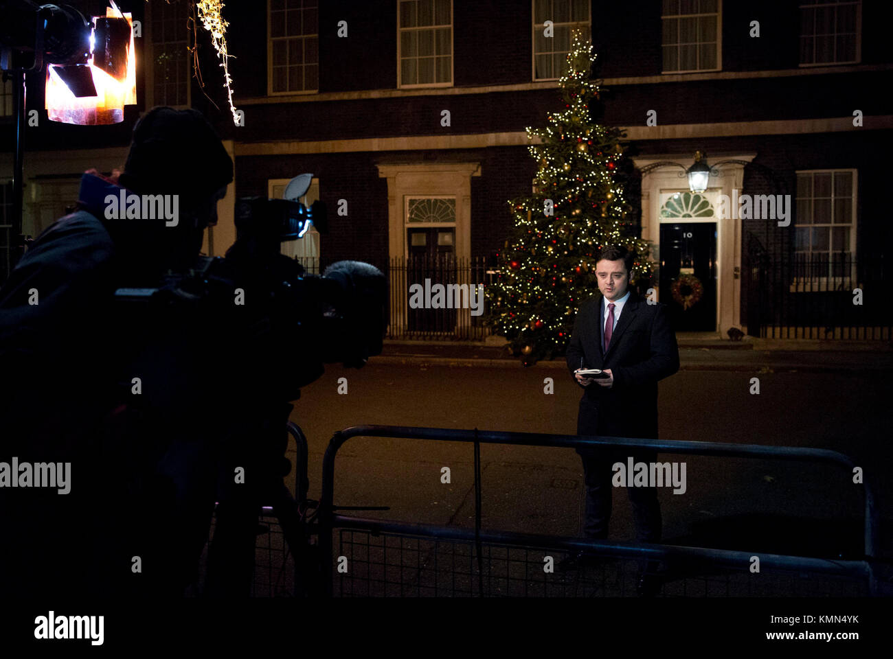 A TV reporter speaks to camera in Downing Street, London, as the ...