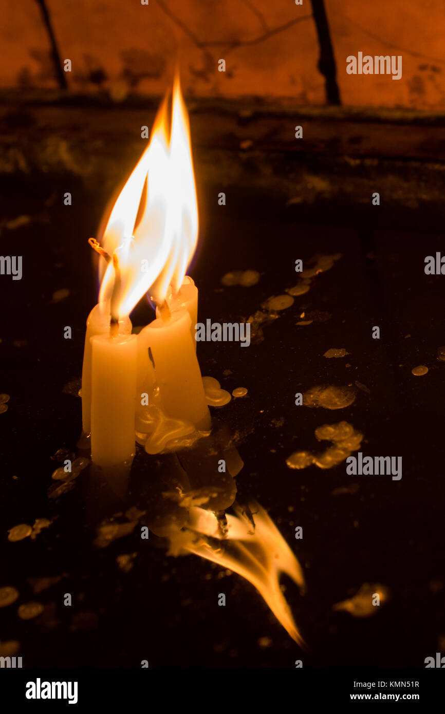 Burning candles with candle light in the dark Stock Photo - Alamy
