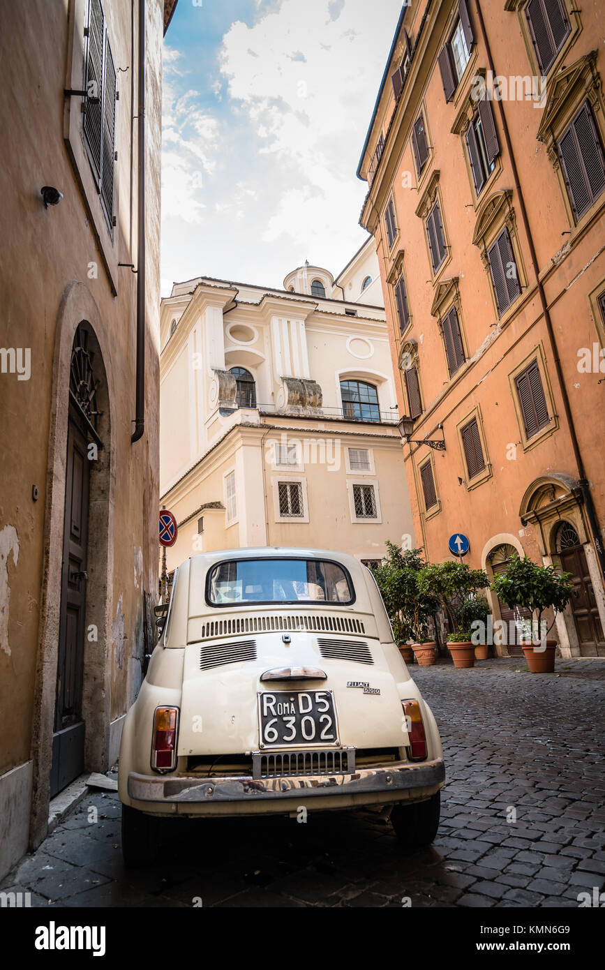 Small car in street in Rome Stock Photo - Alamy