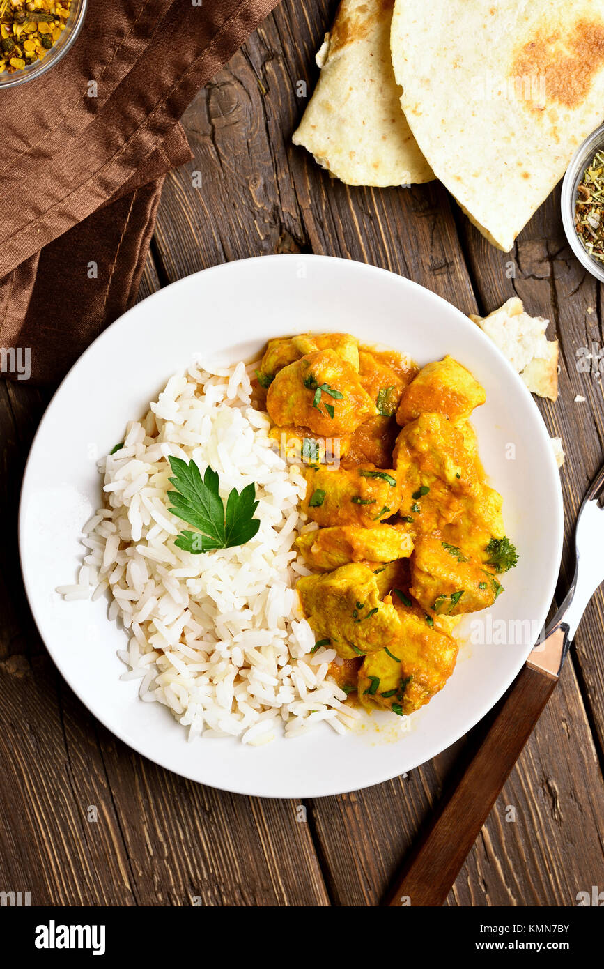 Chicken curry with rice on wooden background. Top view, flat lay Stock ...