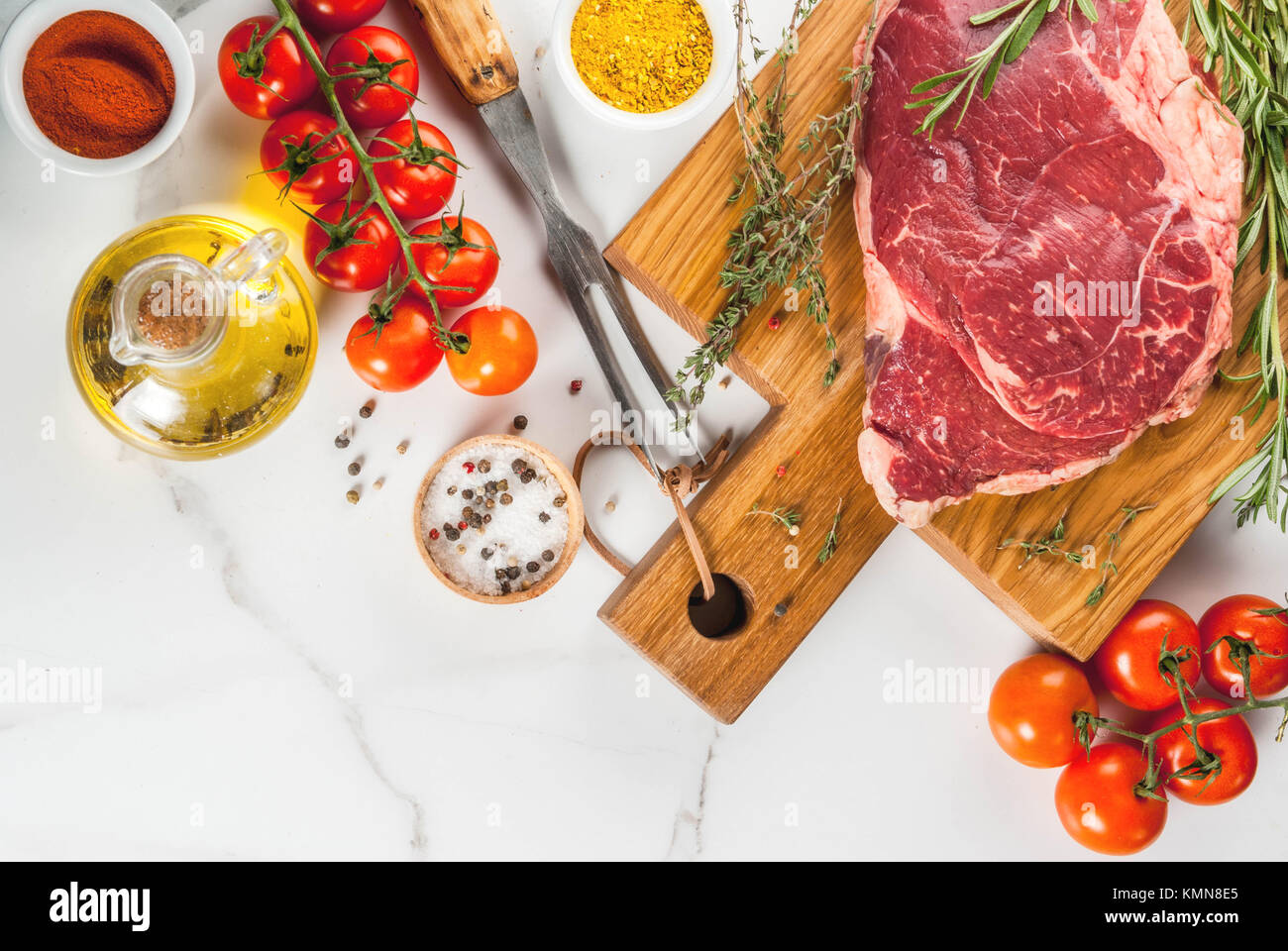 Fresh raw meat, lamb beef marble steak on a cutting board, with ...